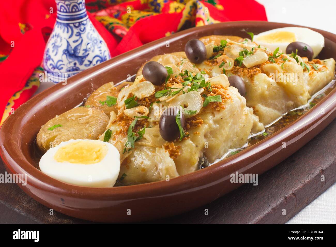 Traditional Portuguese Cod with nozete potatoes and olives Stock Photo ...