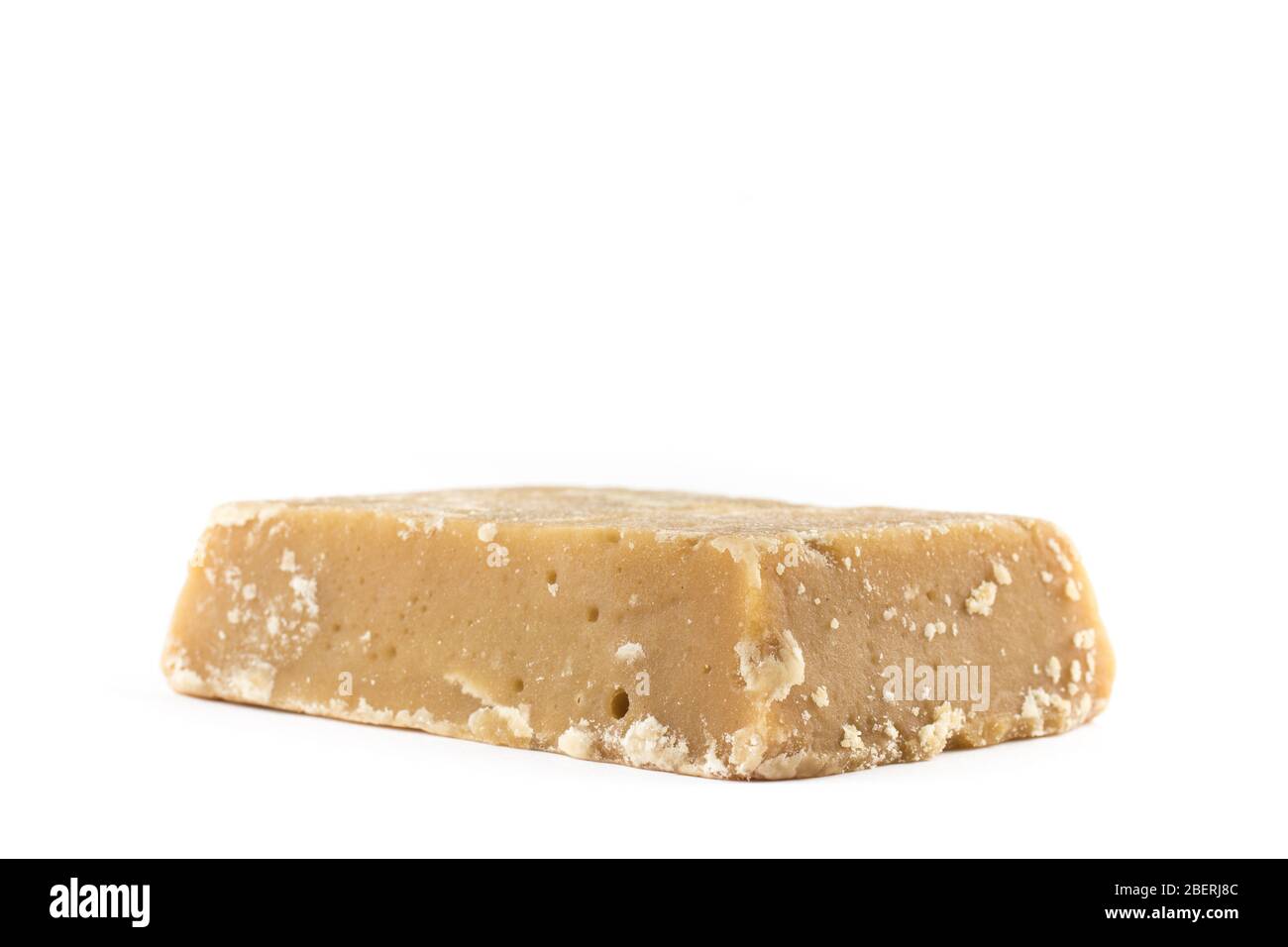 Jaggery cane sugar. Rapadura isolated on white background Stock Photo ...
