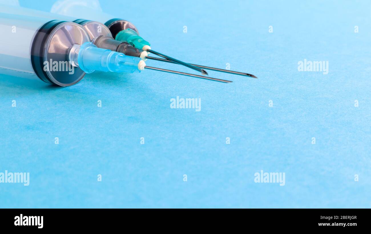 Three medical disposable plastic empty syringes with needles of ...