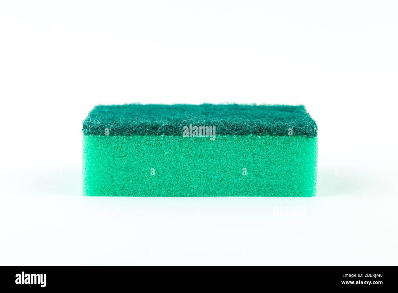 Sponge for wash utensil. isolated on white Stock Photo - Alamy