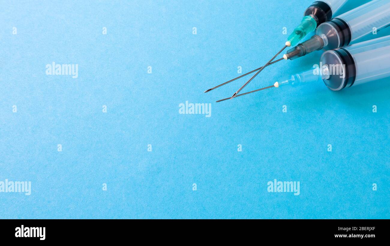 Three medical disposable plastic empty syringes with needles of ...