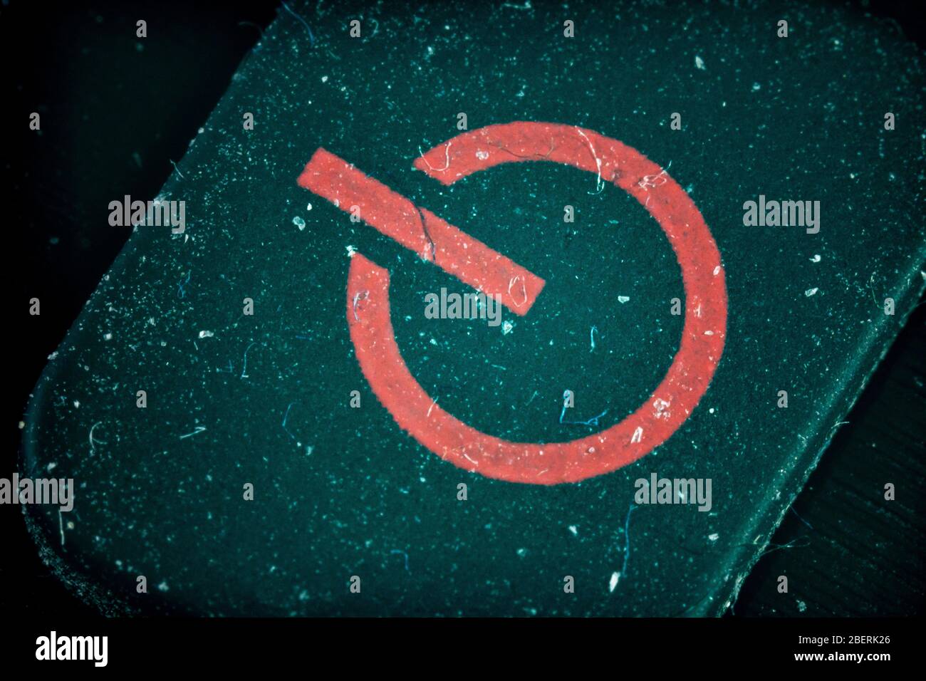 Macro shot of dirty remote control button with dust, skin cells and ...