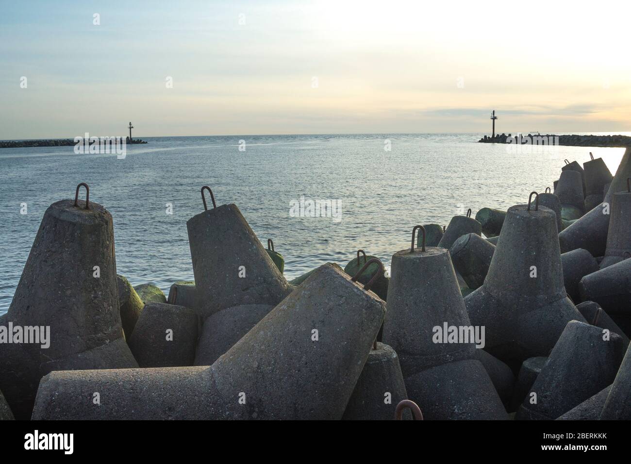 gates to the sea breakwater mole pier evening clear sky Stock Photo - Alamy