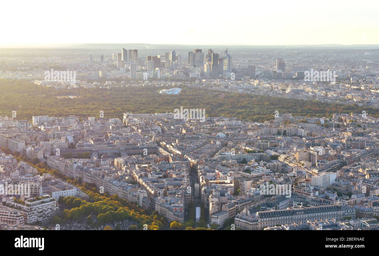 Parisian cityscape at sunset from elevated viewpoint. View of La Defense business district and ...