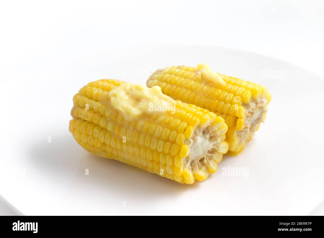 Cooked Corn Cob with butter on white background. Milho verde Stock ...