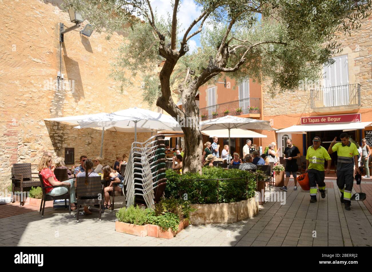 Begur, Spain - July 25, 2017: People at small plaza in the old town of ...
