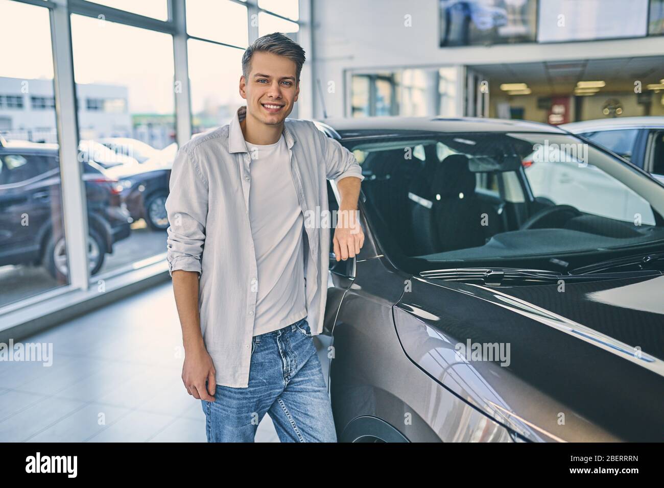 Man standing behind car hi-res stock photography and images - Alamy