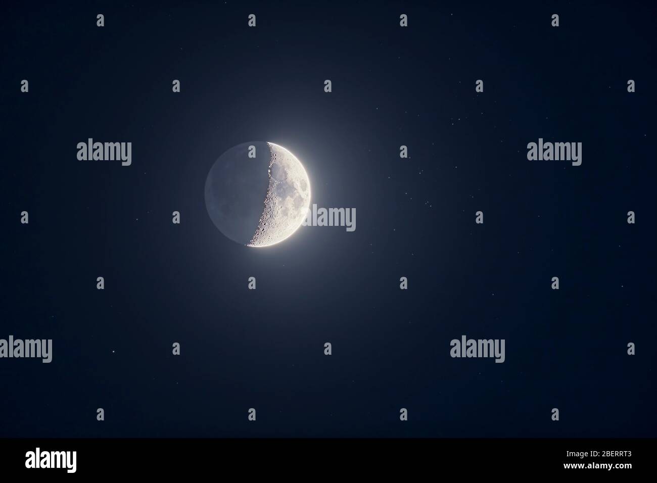 The 5-day-old waxing crescent moon near the Beehive star cluster Stock ...