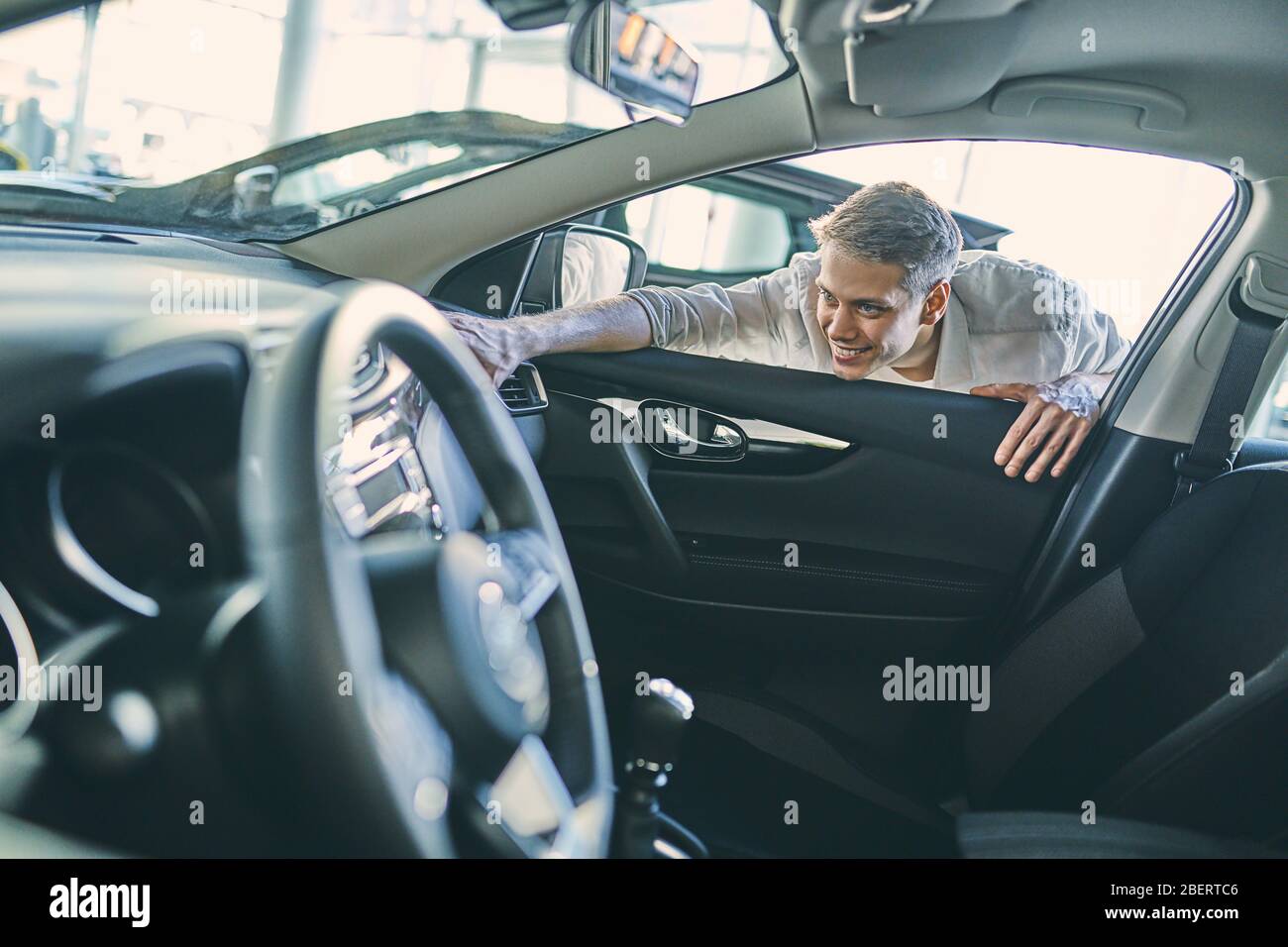 Handsome customer checking car hi-res stock photography and images - Alamy