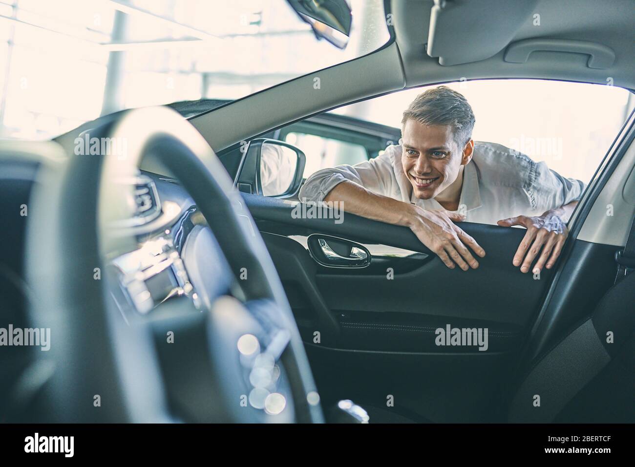 Handsome customer checking car hi-res stock photography and images - Alamy