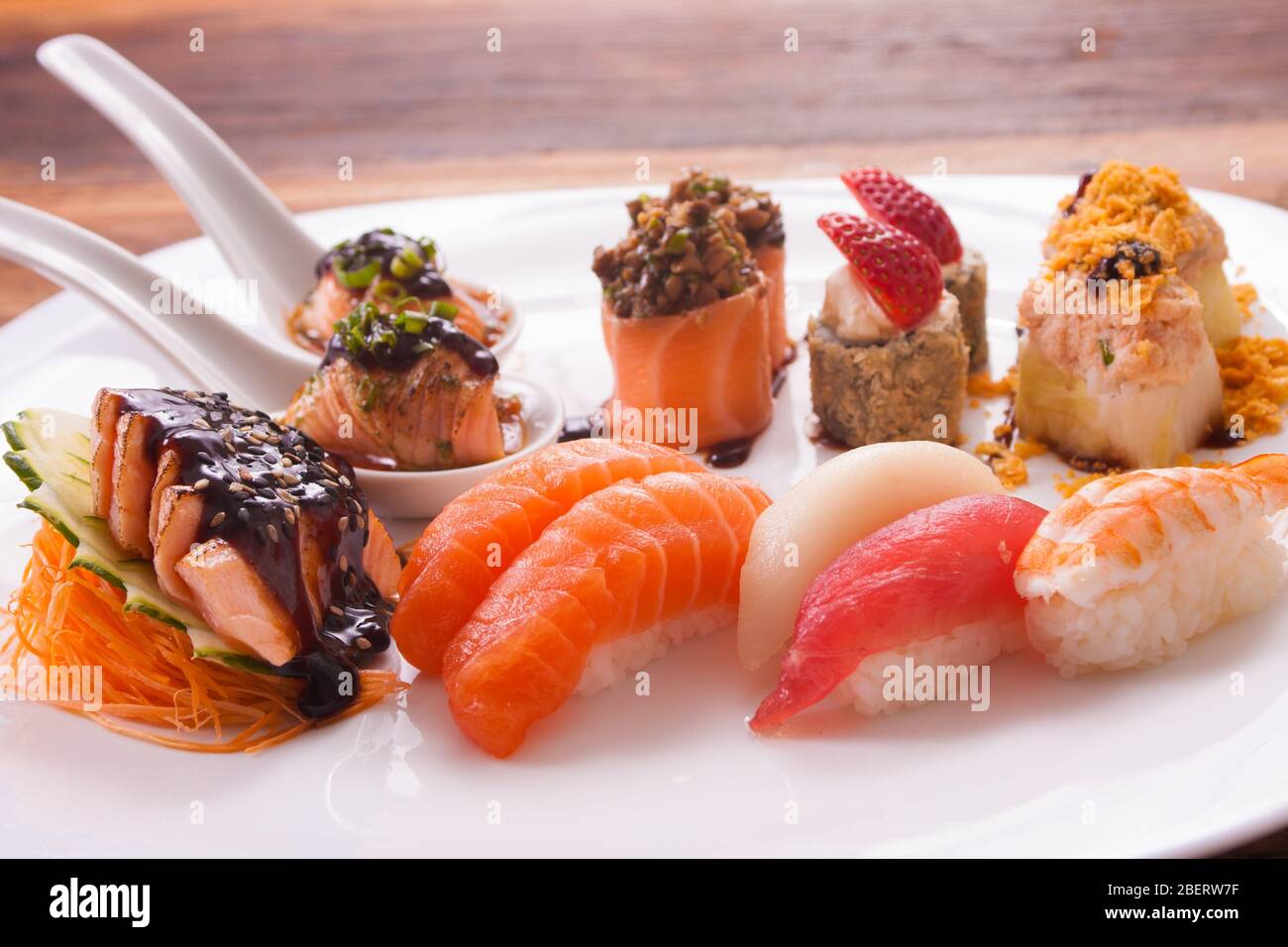 Traditional Japonese Food with sashimi, rolls and sushi Stock Photo - Alamy