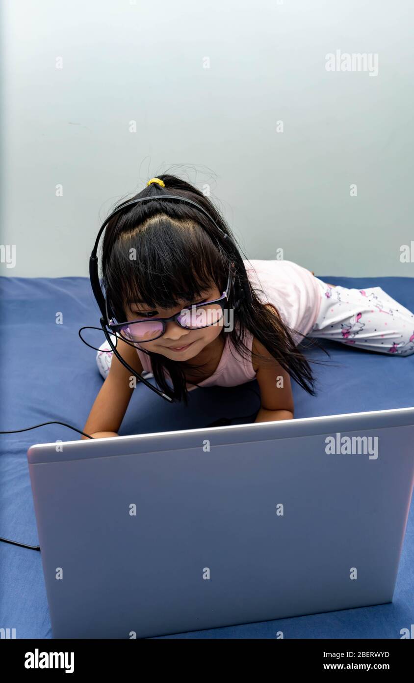 Pretty female child pretending like working from home. Child pretending ...