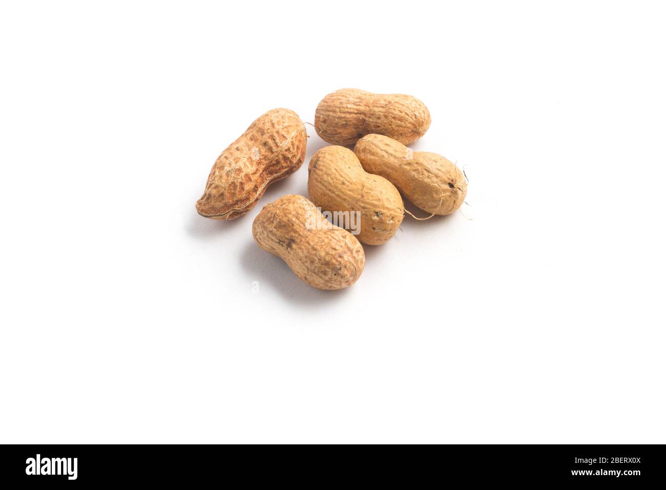 Peanut pile. Shell Seeds on white background Stock Photo - Alamy