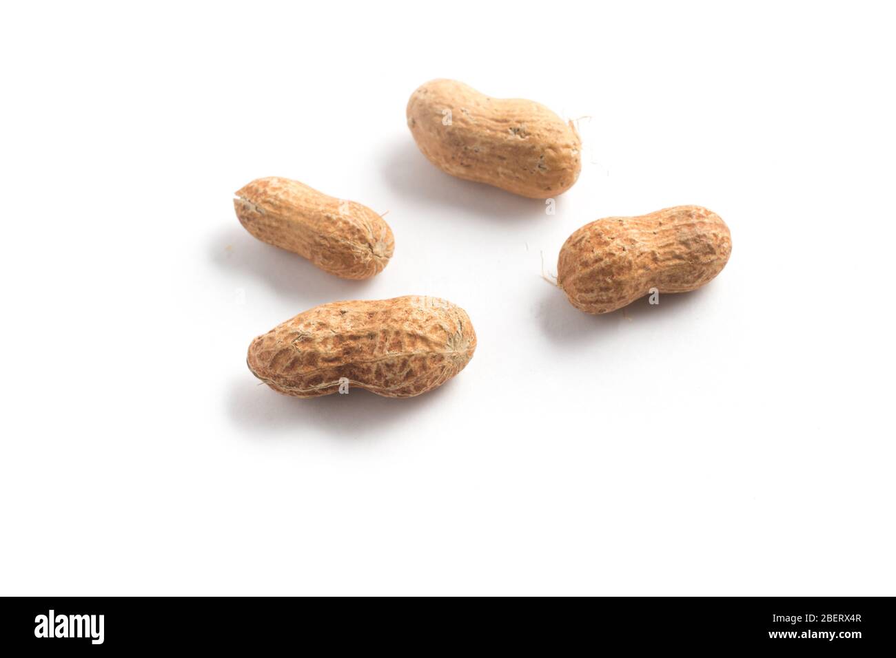 Peanut pile. Shell Seeds isolated on white background Stock Photo - Alamy