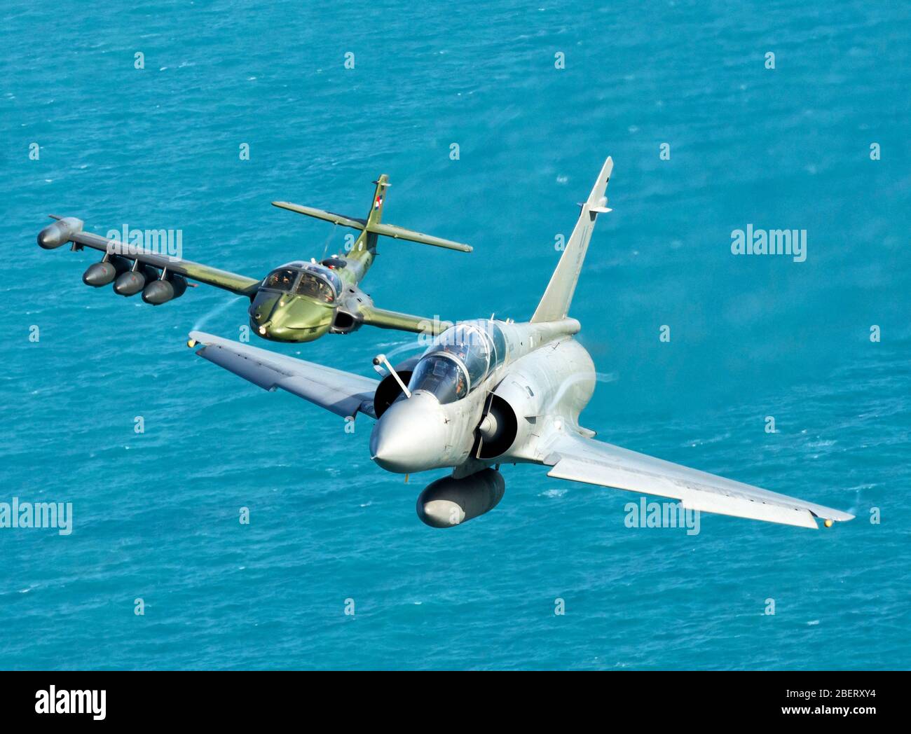 Peruvian Air Force Mirage-2000 with an A-37 following close behind ...