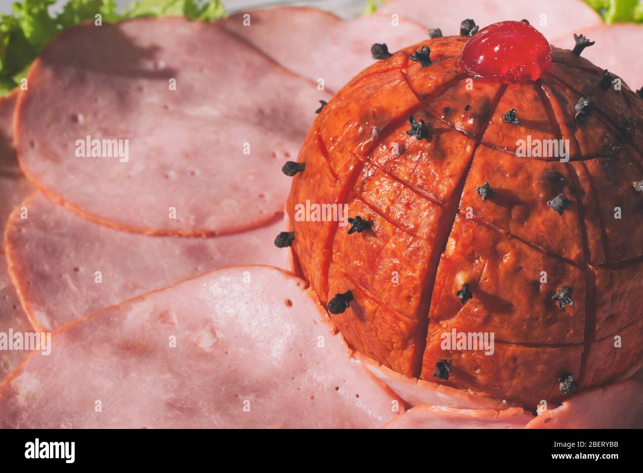 Smoked Christimas Ham Sliced with lettuce and blackhead Stock Photo - Alamy