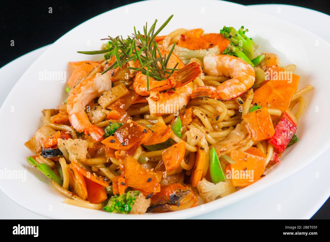Traditional Japonese Yakisoba with vegetables and sea food Stock Photo ...