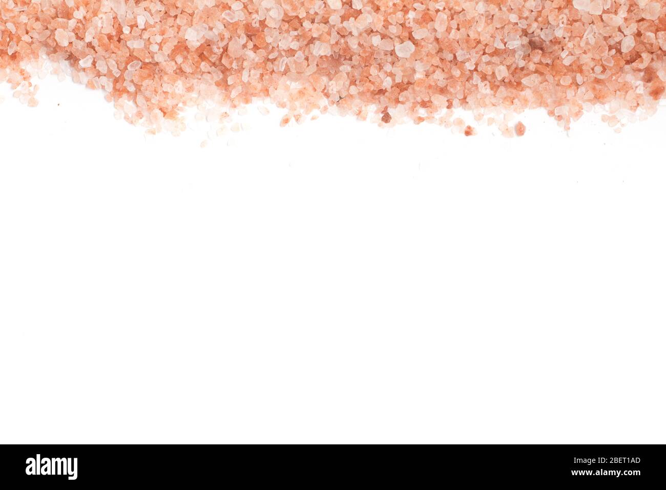 Himalayan pink salt frame in white background Stock Photo - Alamy