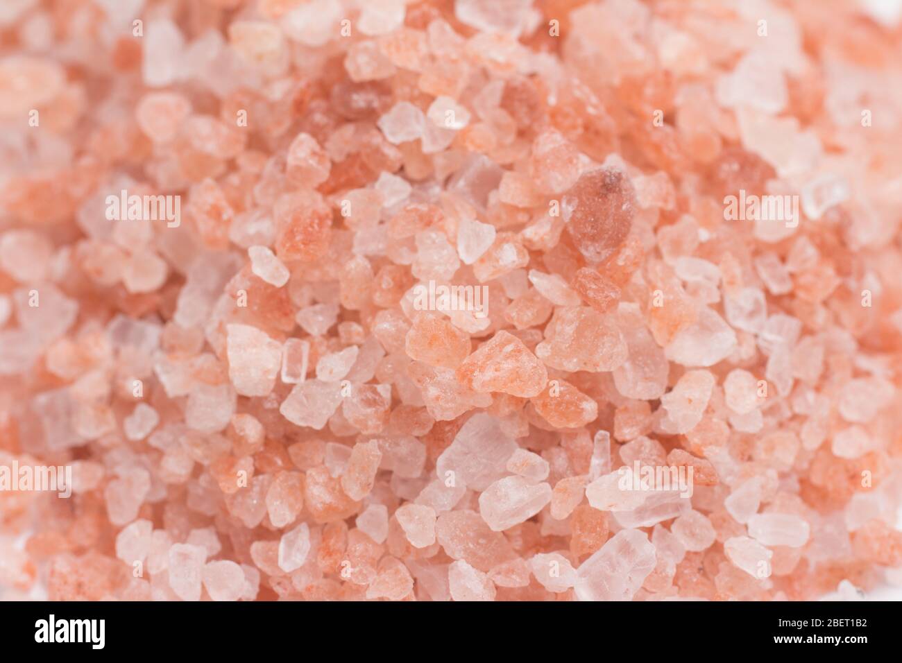 Himalayan pink salt in white background Stock Photo - Alamy
