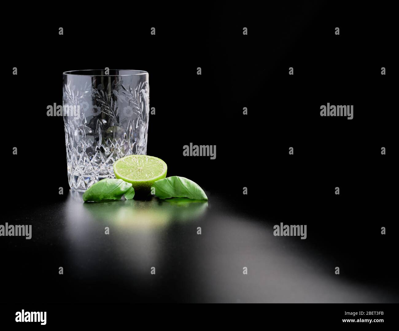 Crystal glass for homemade cocktails with lime and basil Stock Photo ...