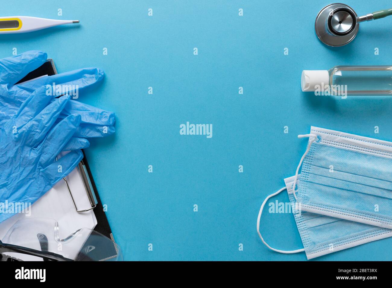 Doctors and nurses protection kit on a lue background, top view Stock ...