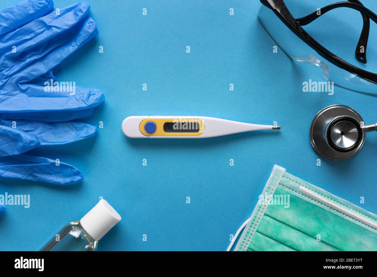 Doctors and nurses protection kit on a lue background, top view Stock ...