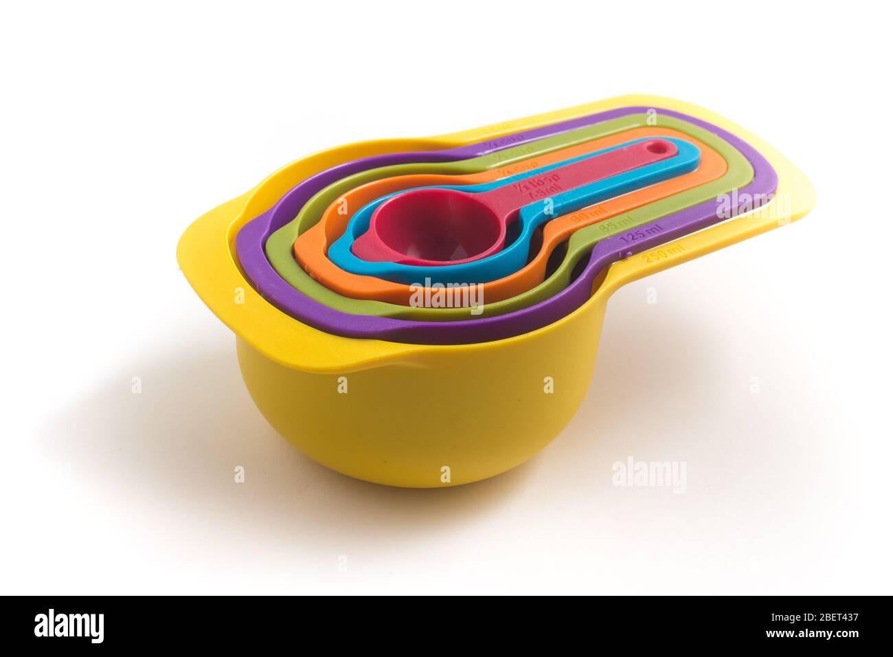 Colorfull Measuring Cup isolated on white background Stock Photo - Alamy