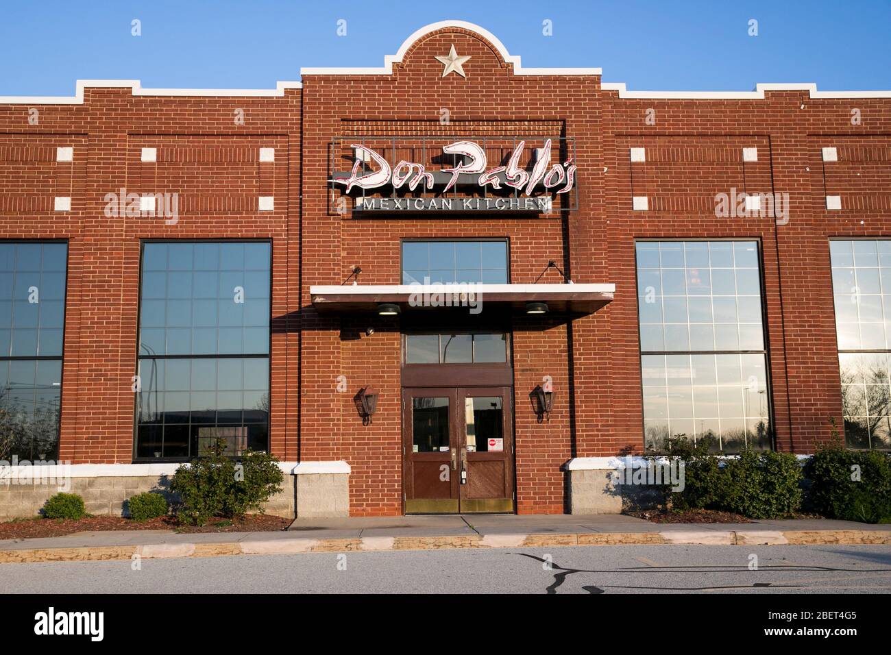 A logo sign outside of a no longer operating Don Pablo’s restaurant ...