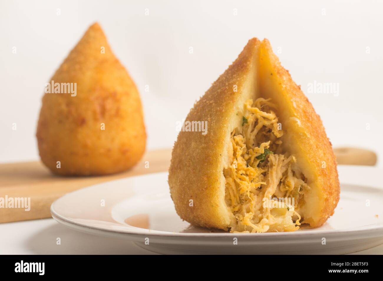 Brazilian Chicken Coxinha over a white background Stock Photo - Alamy