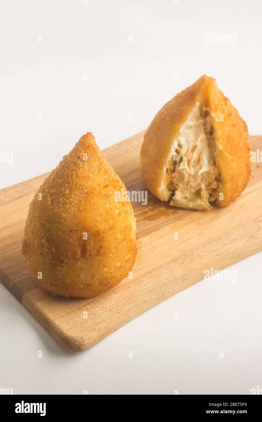 Brazilian Chicken Coxinha over a white background Stock Photo - Alamy
