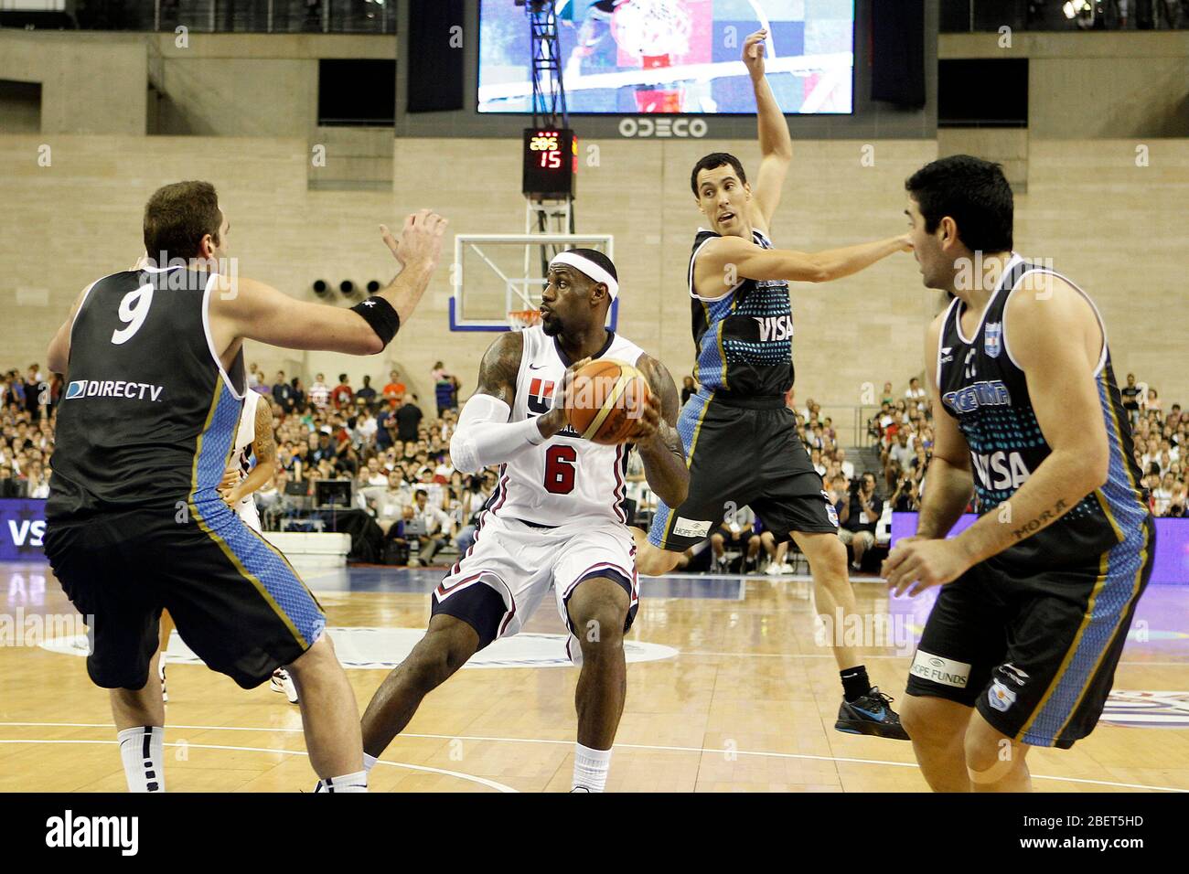USA's LeBron James (c) and Argentina's Juan Gutierrez (l), Pablo ...