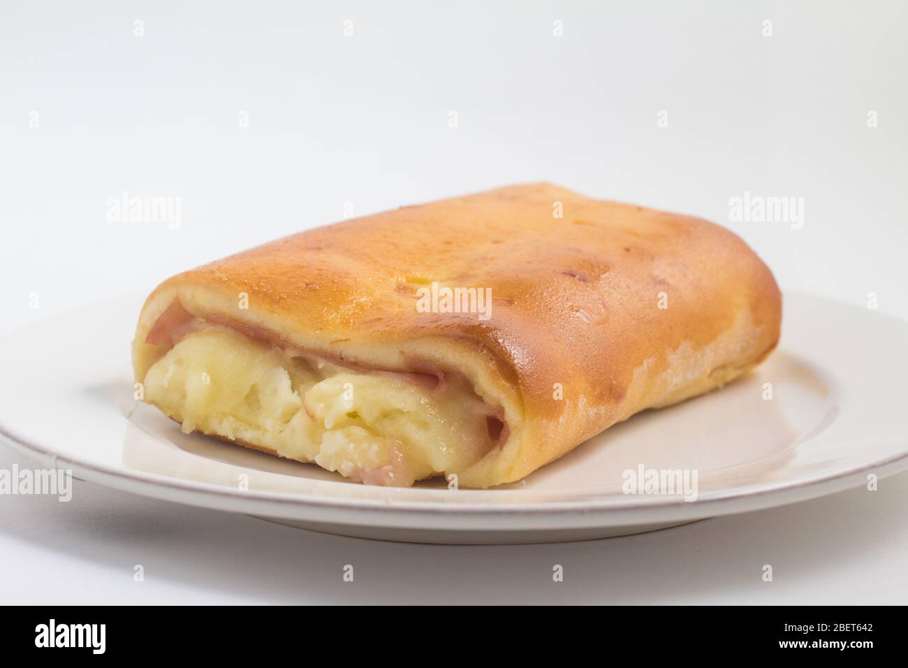 Salgado. Brazilian Snack with cheese and ham on white background Stock ...