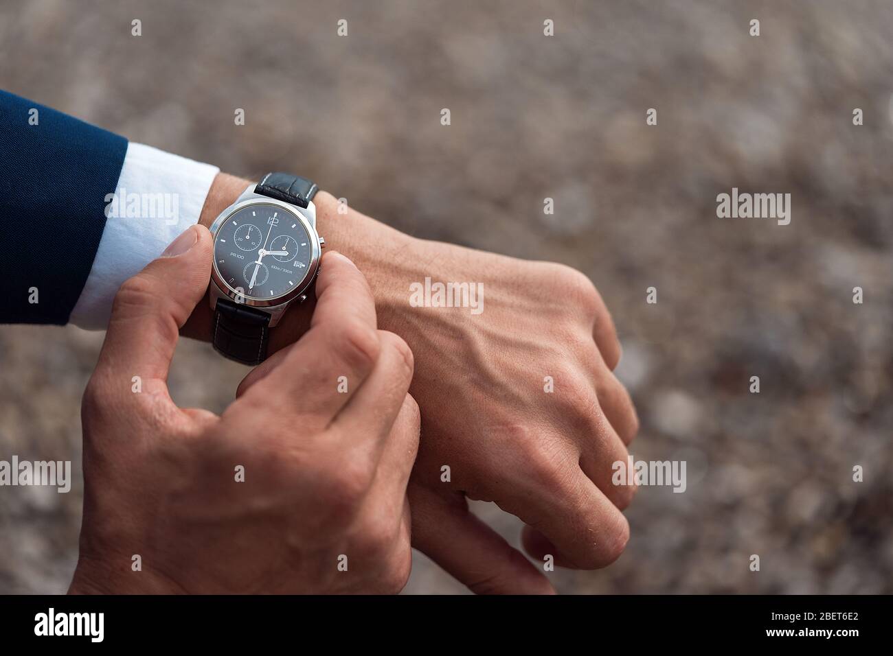 Silver watch on man hand hi-res stock photography and images - Alamy