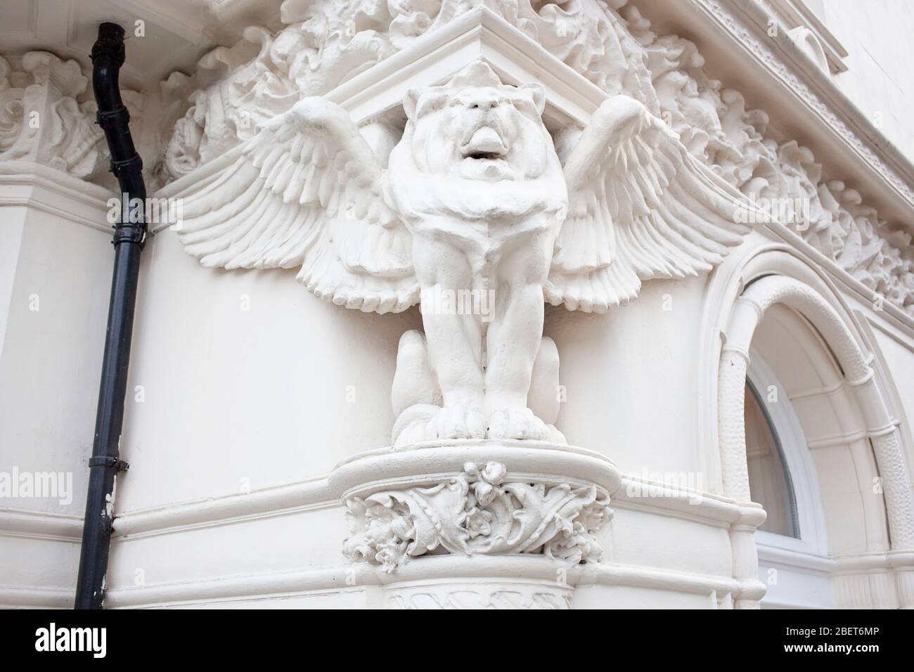 A winged lion statue on a building exterior Stock Photo - Alamy