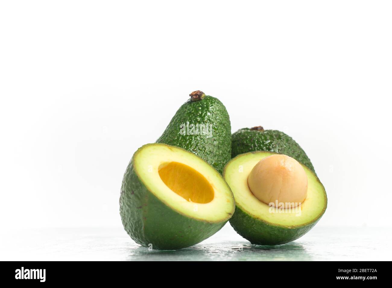 Mini Baby Avocado on white background Stock Photo - Alamy