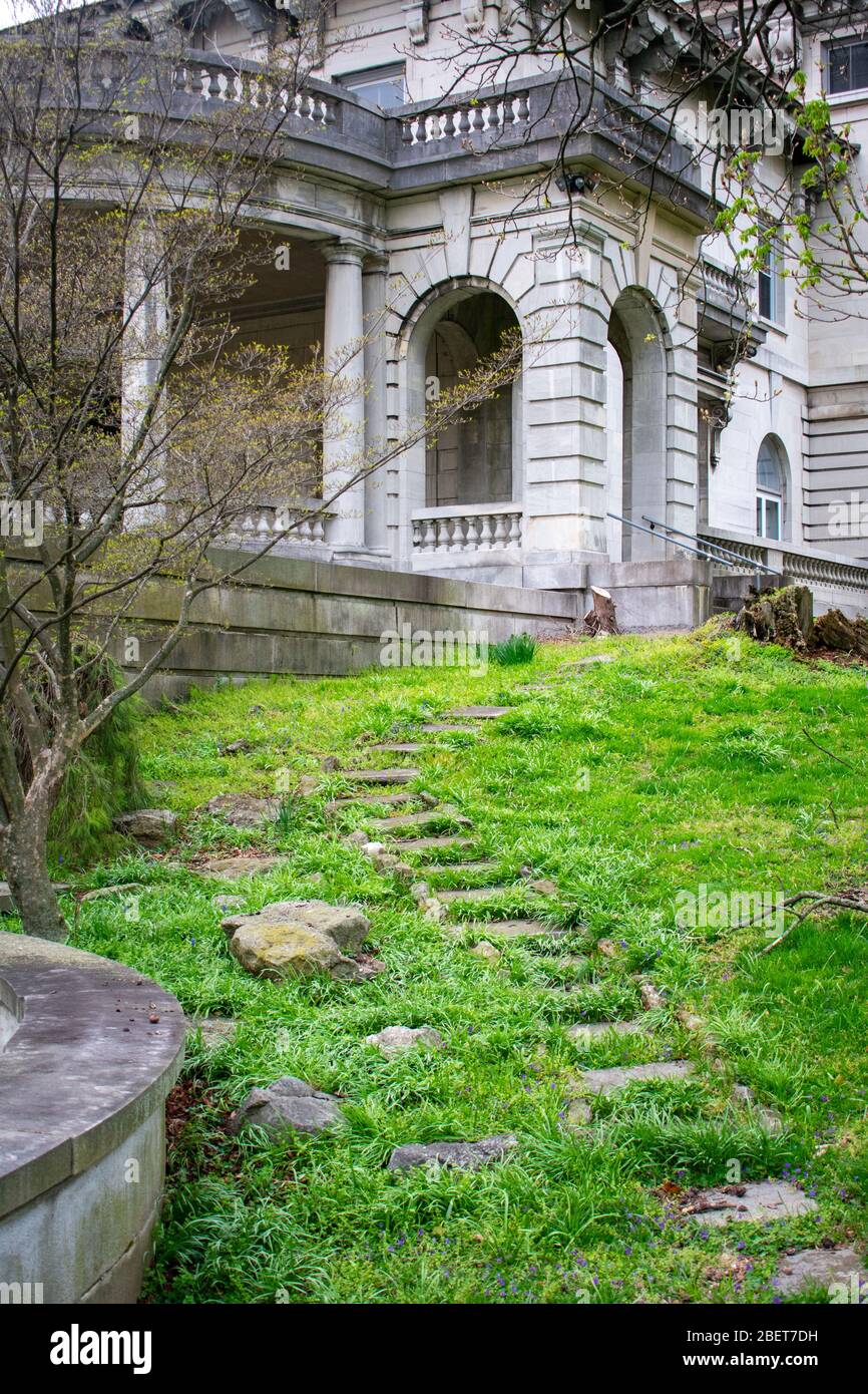 An Overgrown Stone Path Leading Up to a Luxurious Mansion Stock Photo ...