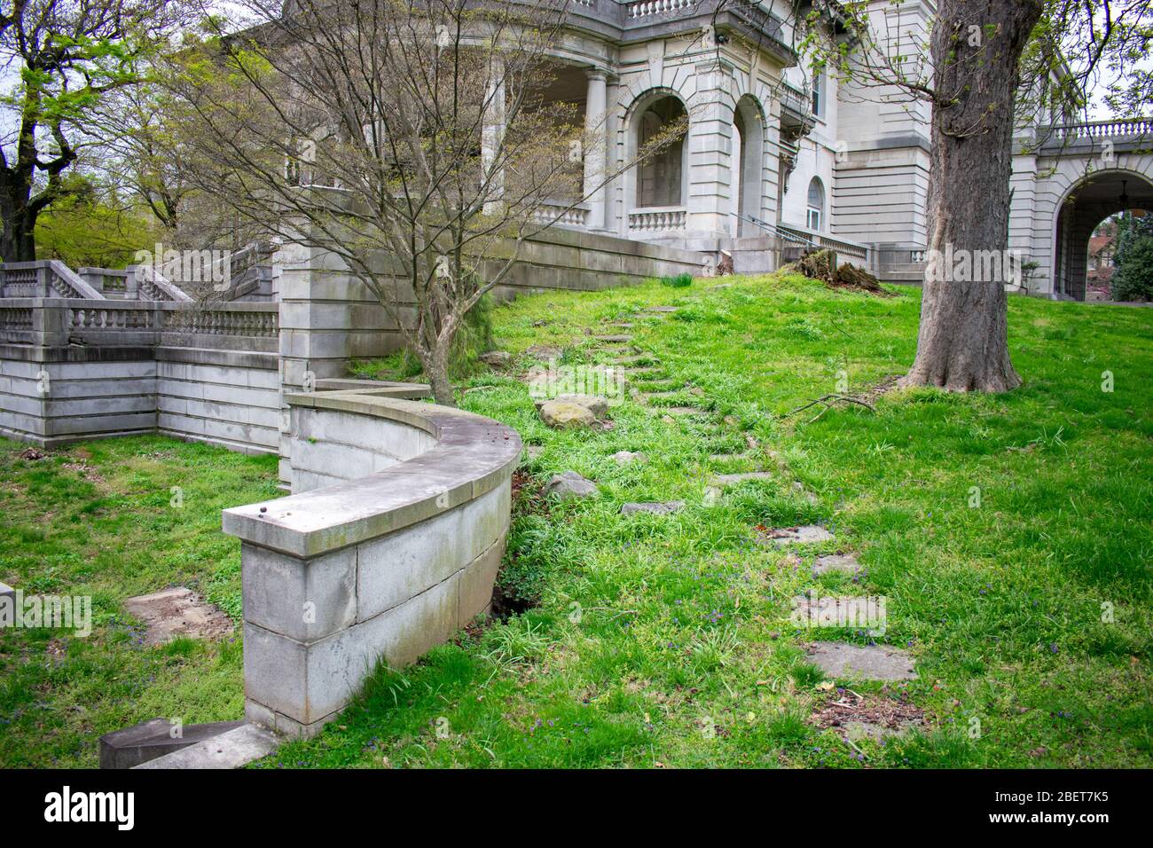 An Overgrown Stone Path Leading Up to a Luxurious Mansion Stock Photo ...