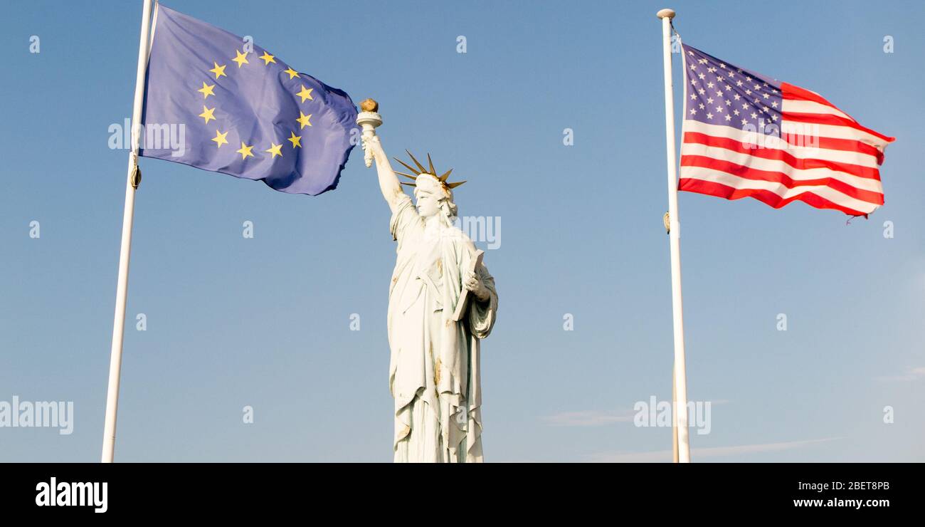 Ellis Island with statue of liberty and usa europe flag in wind Stock ...
