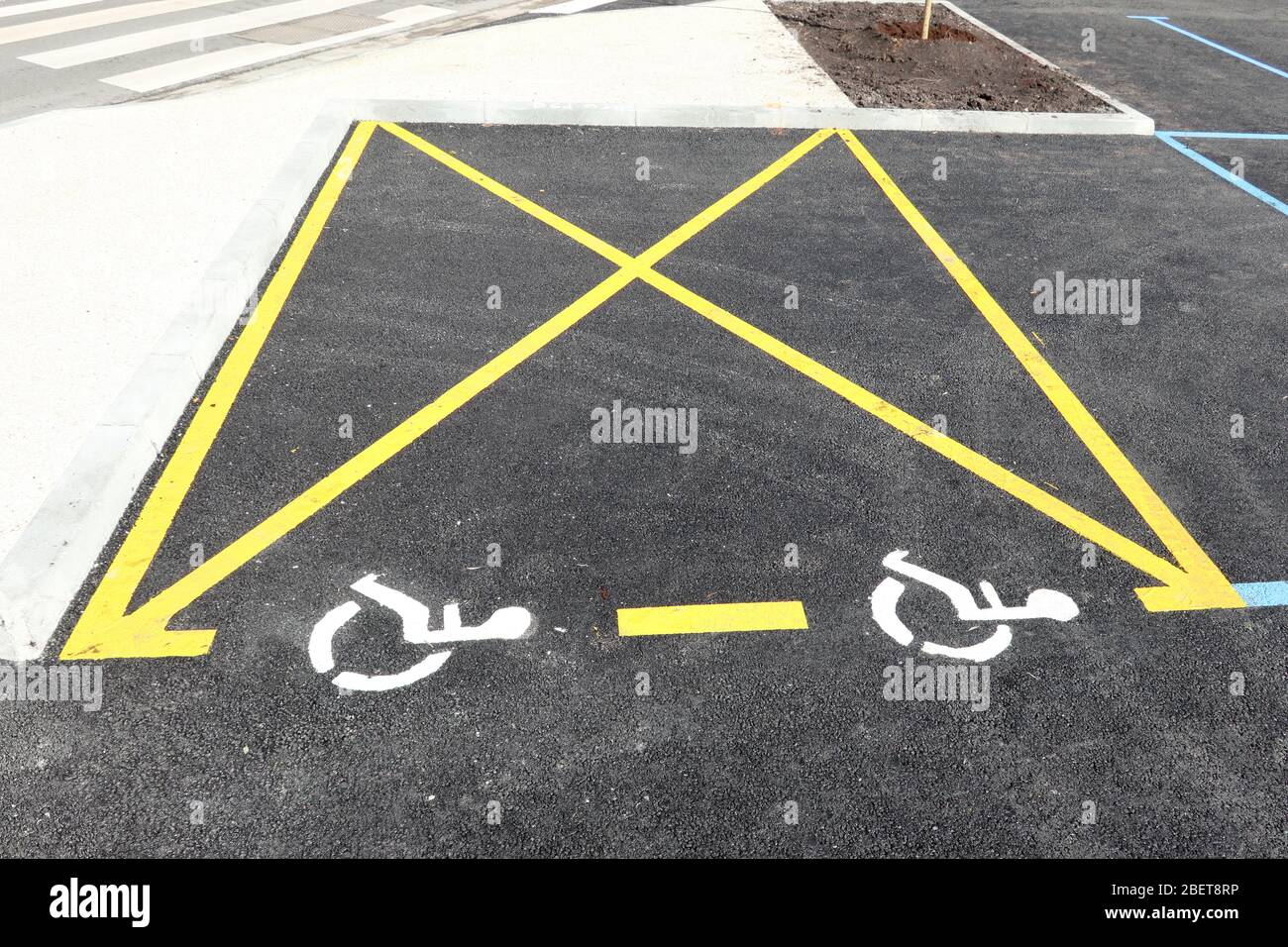 yellow Handicapped disabled icon sign on parking area in car park ...
