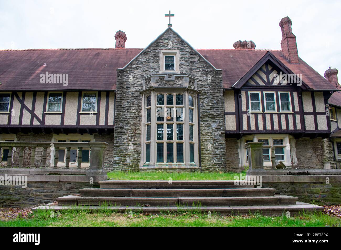 A Detailed Cobblestone Building With a Large Window and a Red Tiled ...