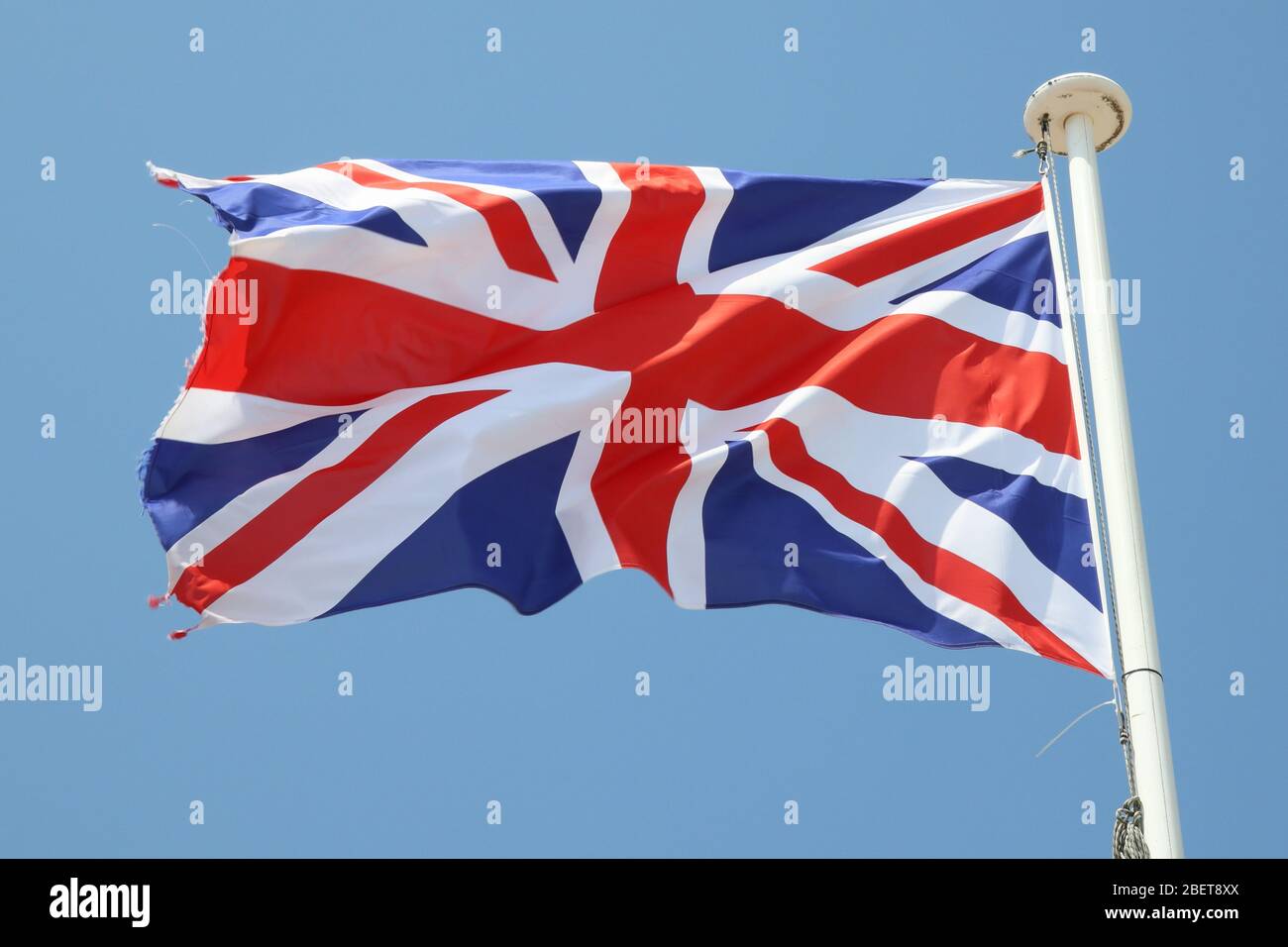the English flag of the United Kingdom of England floats in the wind ...