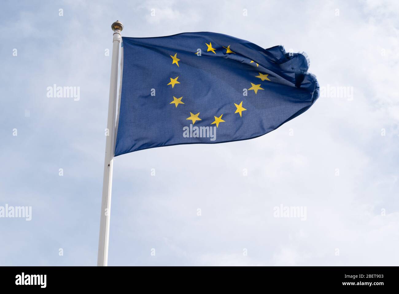 European Union (EU) Flag Waving in cloud sky background Stock Photo - Alamy