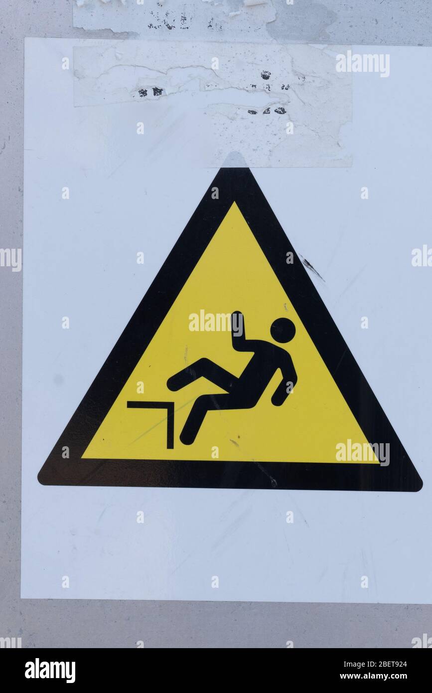 signage risk caution danger of falling Stock Photo - Alamy