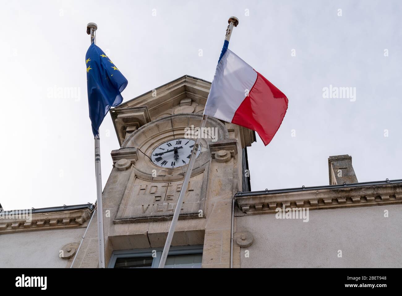 Europe Union EU and French flag on city hall with clock Stock Photo - Alamy