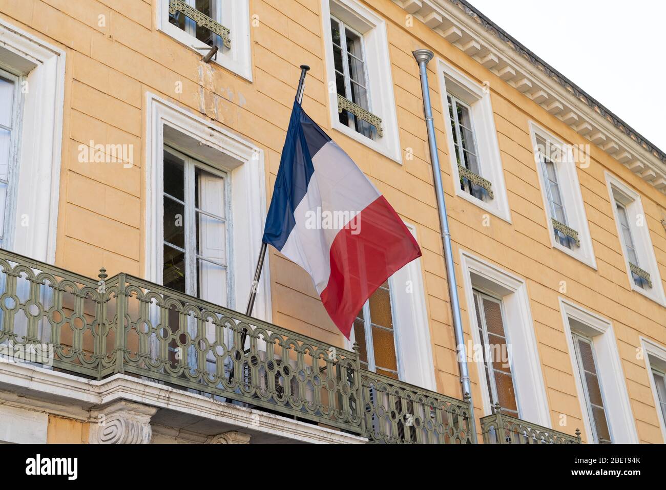 french facade building with the national flags of France Stock Photo ...