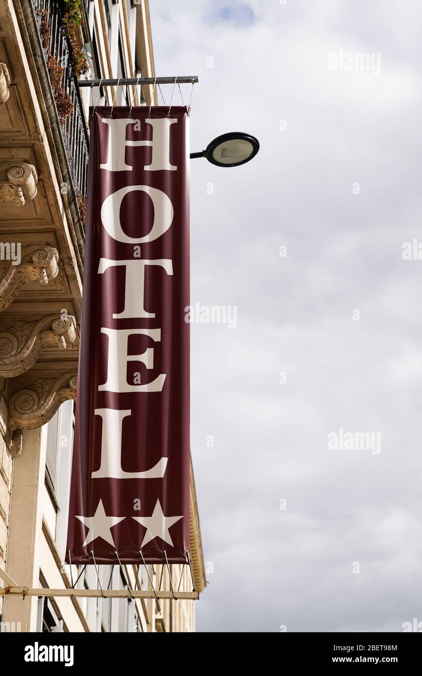 Hotel sign two stars street flag logo hanging Stock Photo - Alamy