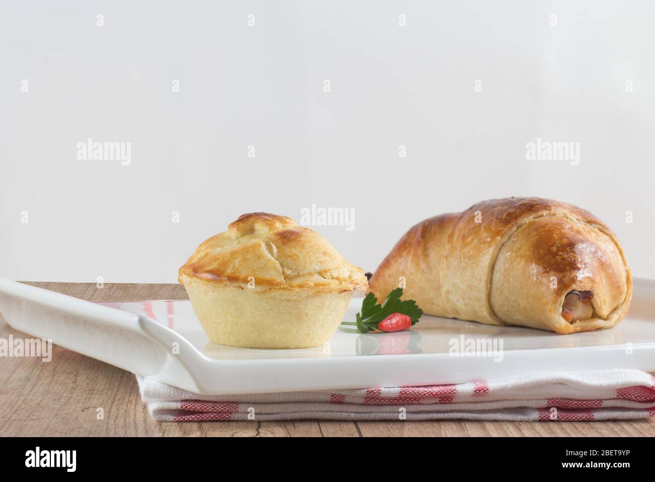 Traditional Brazilian Empada over a wooden table Stock Photo - Alamy