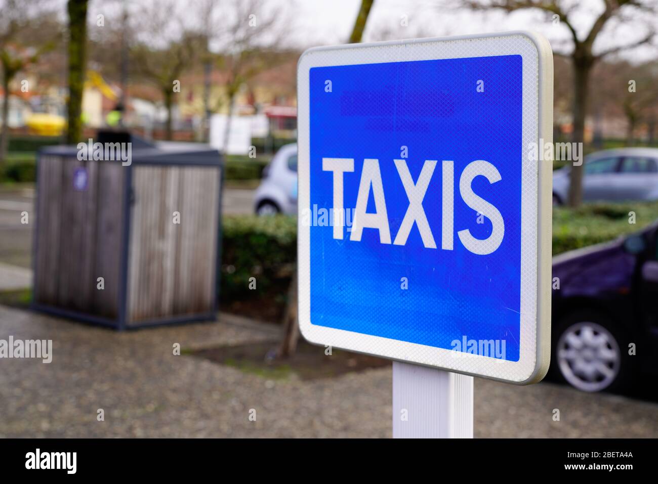 taxi blue sign service signage hanging on pole street Stock Photo - Alamy