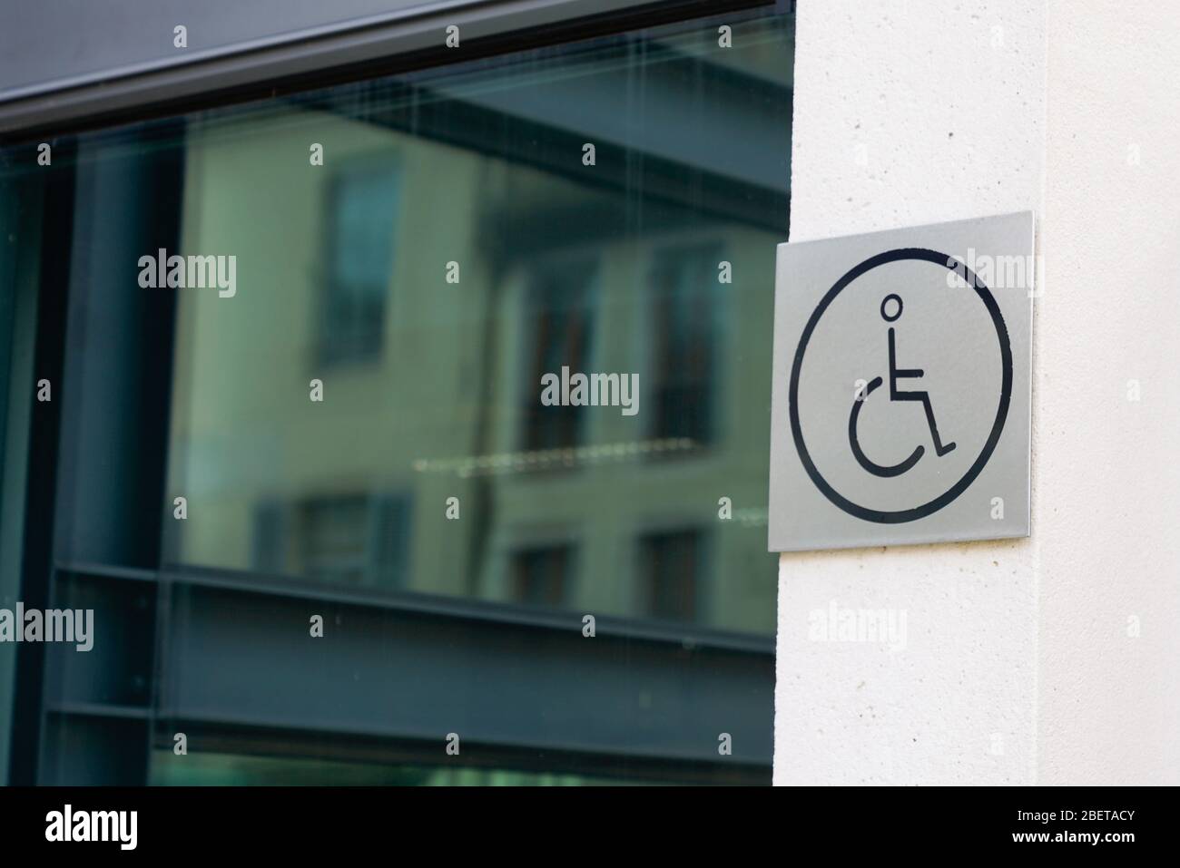 Disabled sign handicap symbol in street building urban city Stock Photo ...