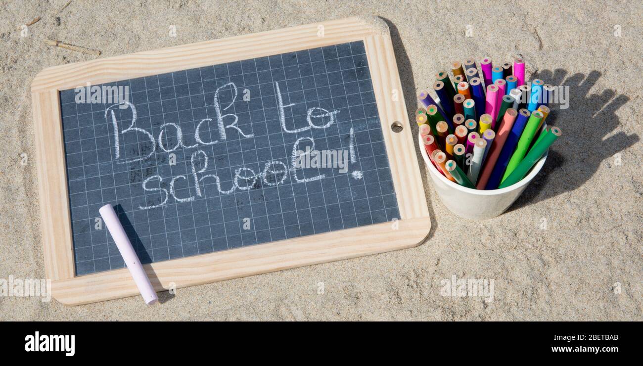 flat lay a school slate with registered back to school accompanied by a ...